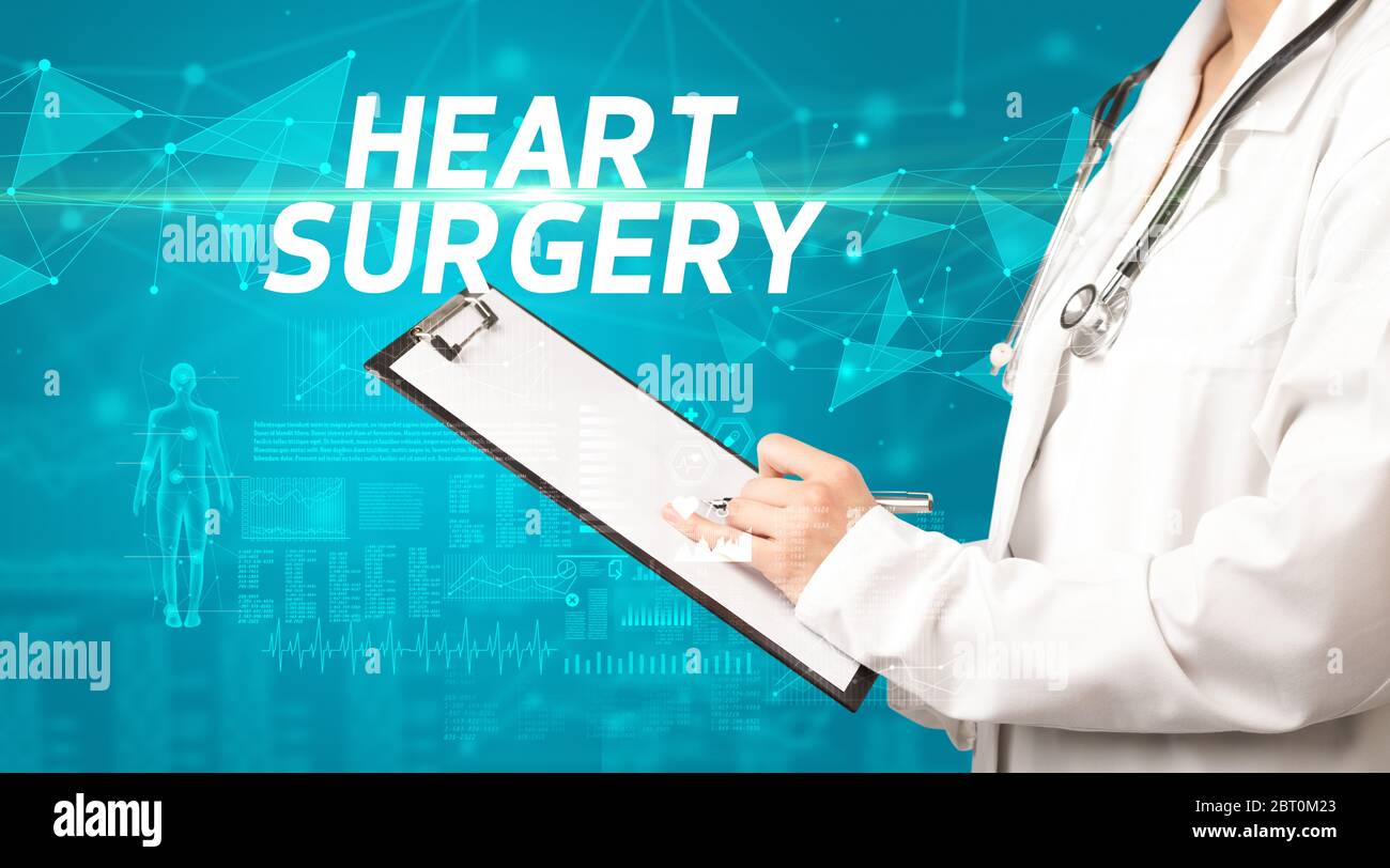 doctor writes notes on the clipboard with HEART SURGERY inscription ...