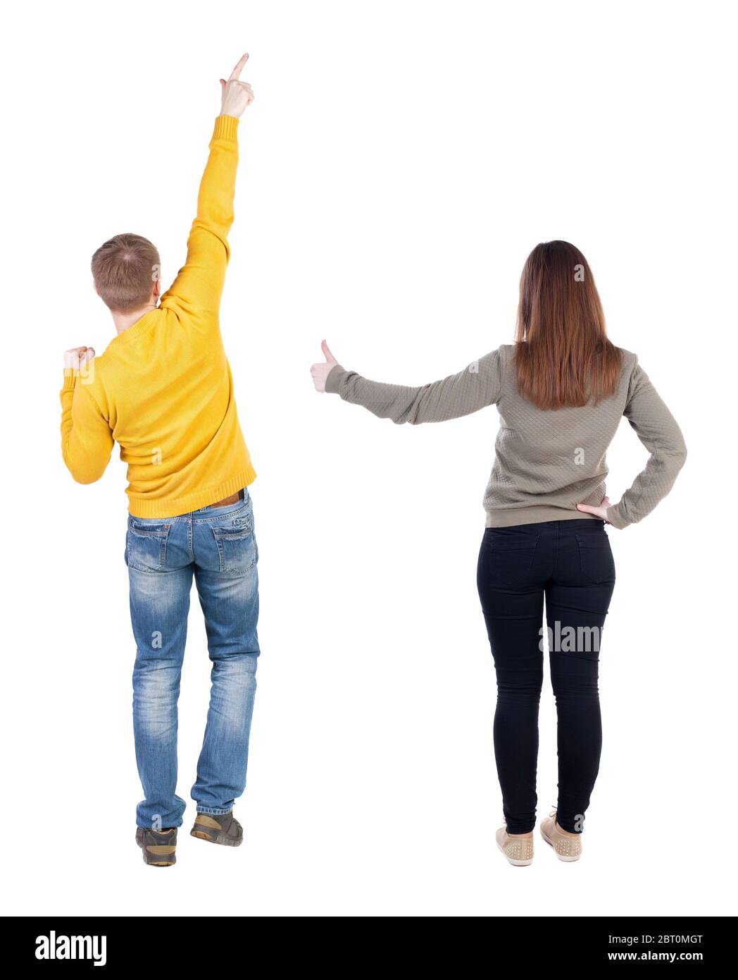 Back view of couple in sweater pointing. Rear view people collection ...