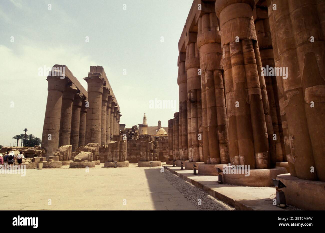 Luxor Temple Colonnade of Amenhotep III and minaret in the background ...