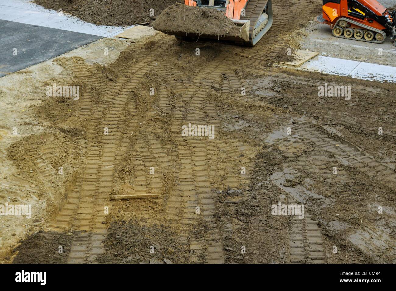 Construction bulldozer leveling and moving soil landscaping works on ...