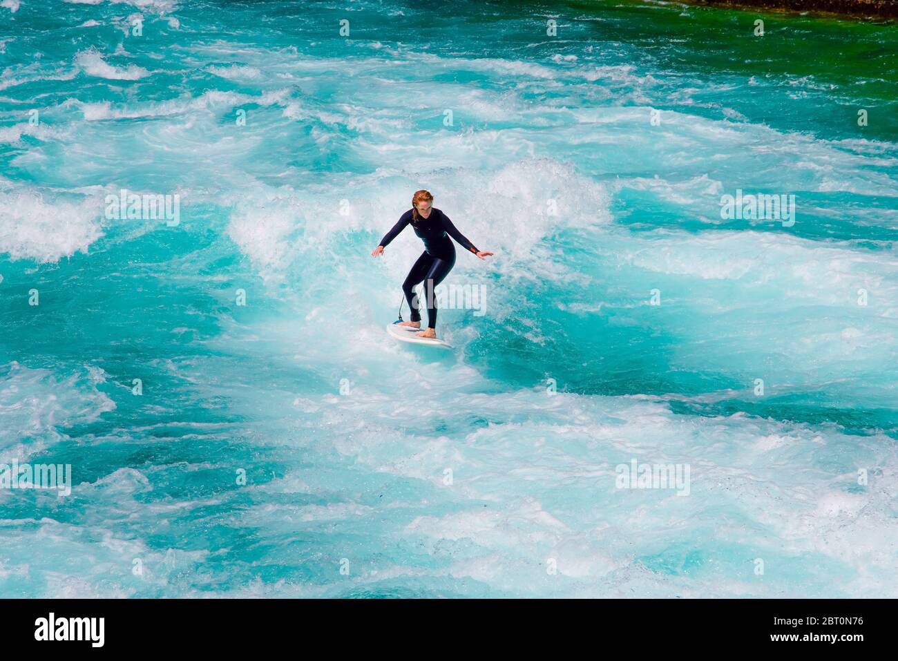 Surfing on the swift waves created when the sluice gates are open on ...