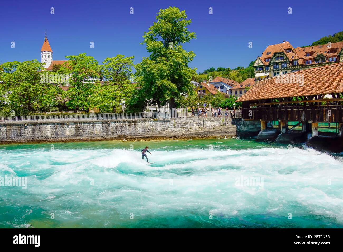 Surfing on the swift waves created when the sluice gates are open on ...