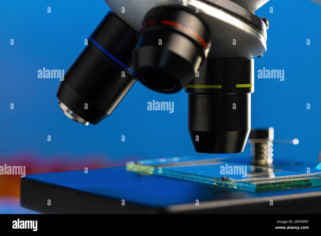 Close up photo of a microscope lenses examining glass sample Stock ...