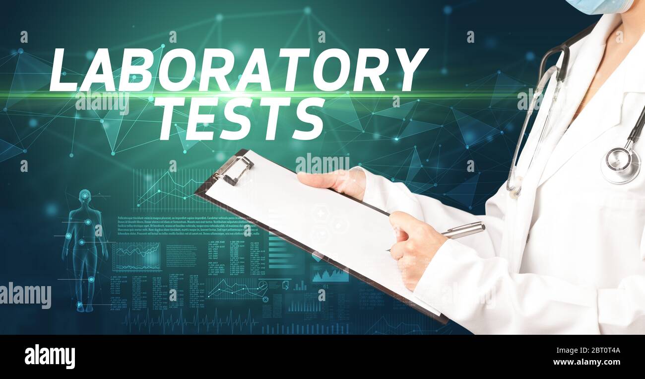 doctor writes notes on the clipboard with LABORATORY TESTS inscription ...
