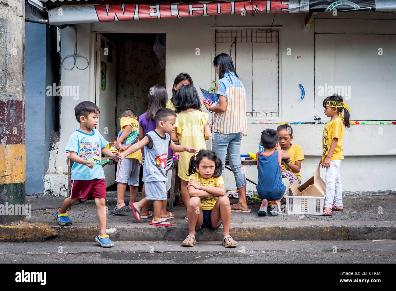 Young Filipino children play in the street in the old walled city of ...
