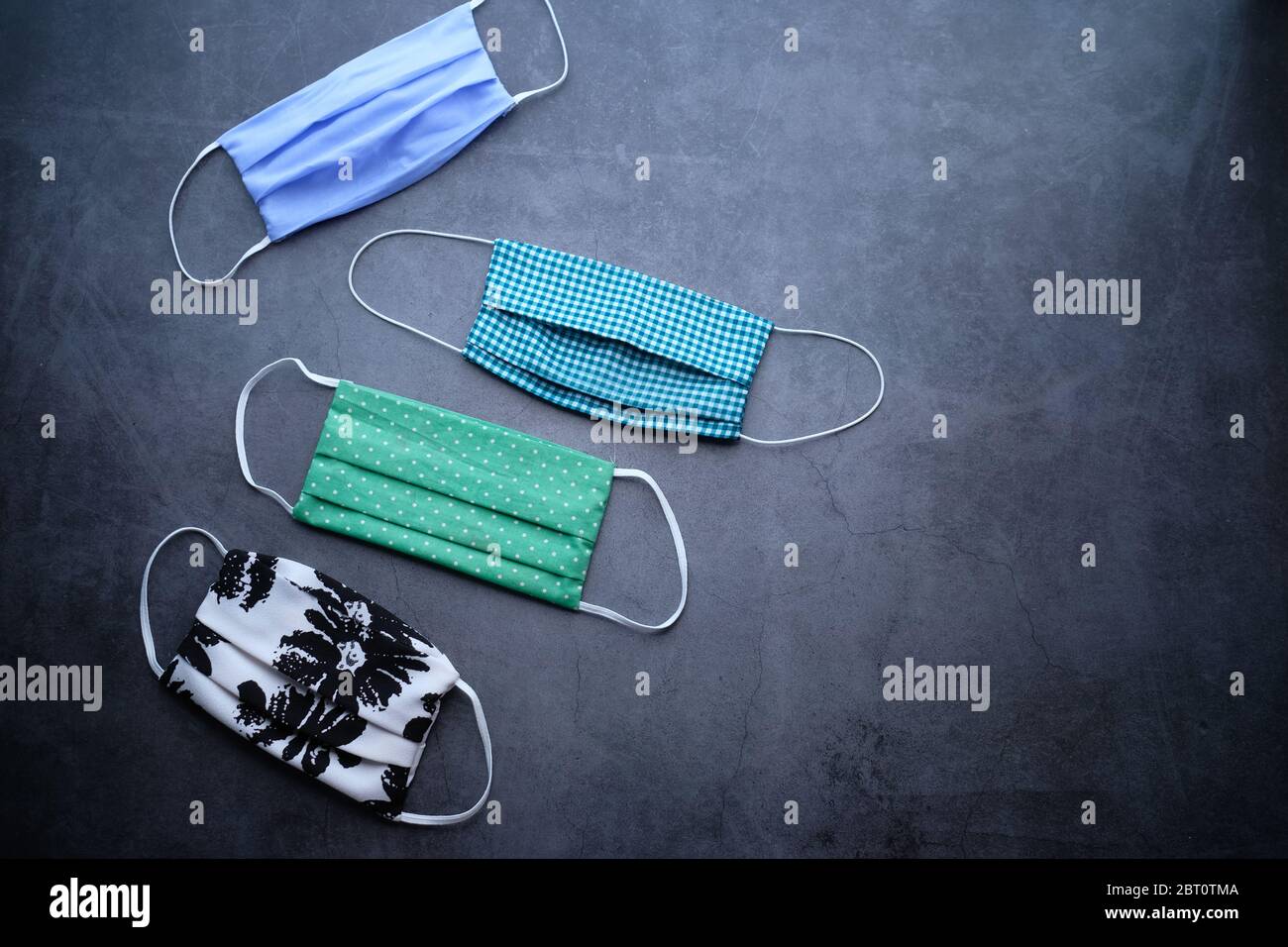 Homemade cotton Face Mask for preventing virus on gray background Stock ...