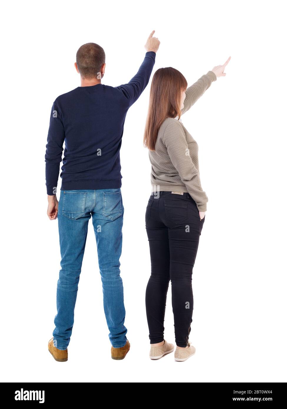 Back view of couple in sweater pointing. Rear view people collection ...