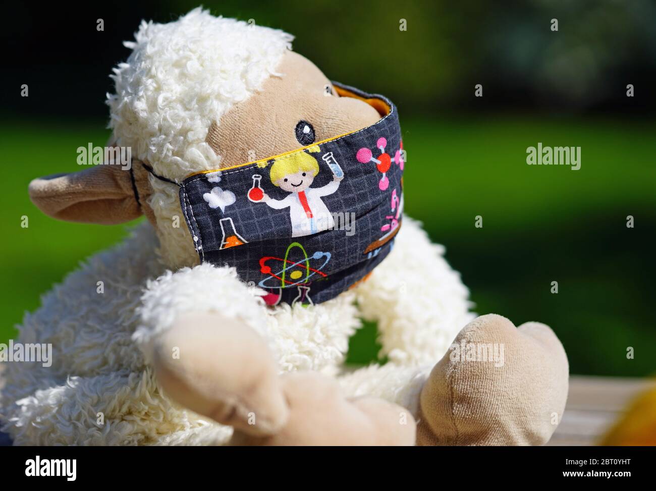 A childrens plush stuffed animal toy wearing a face mask during the ...