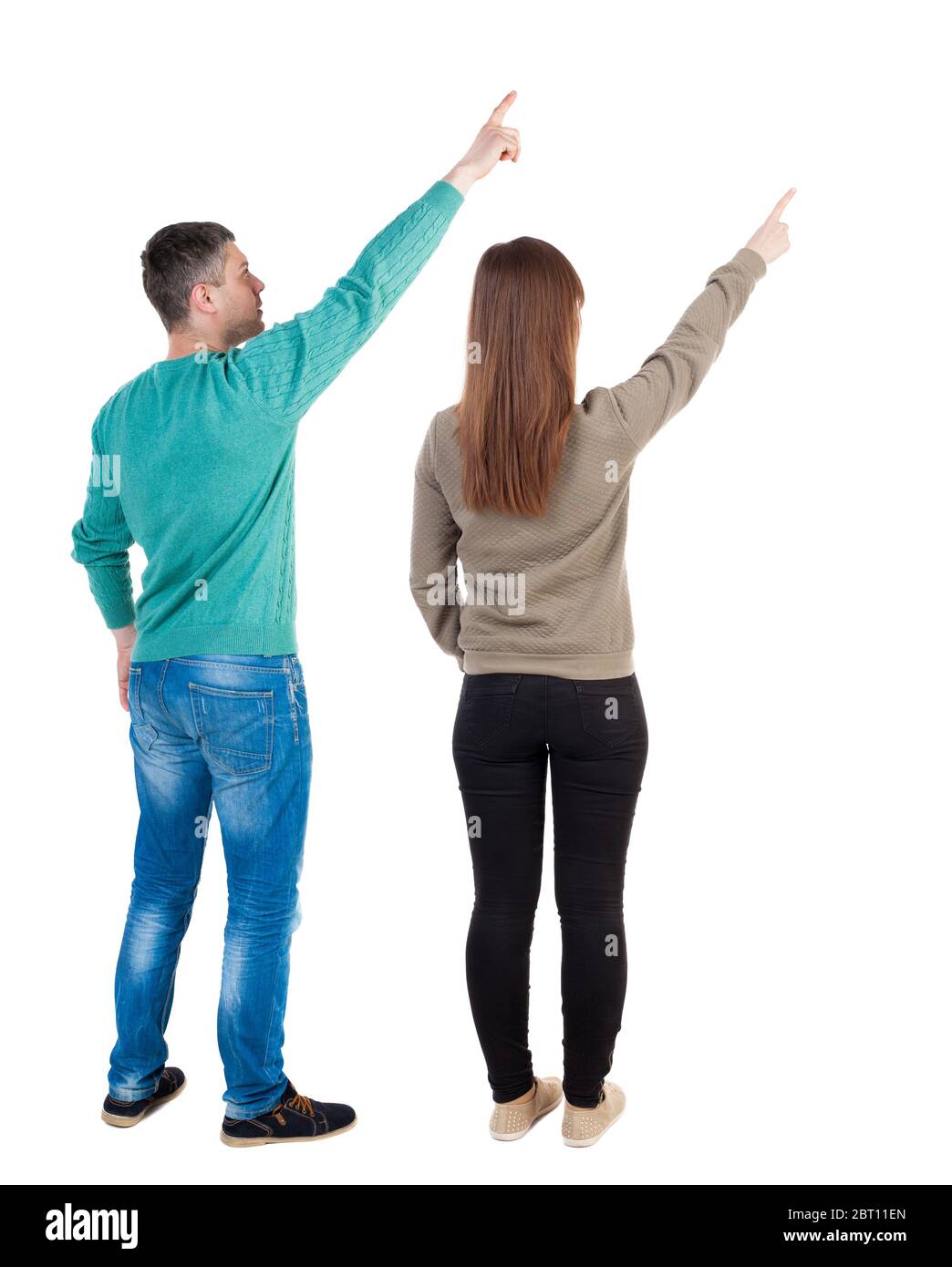 Back view of couple in sweater pointing. Rear view people collection ...