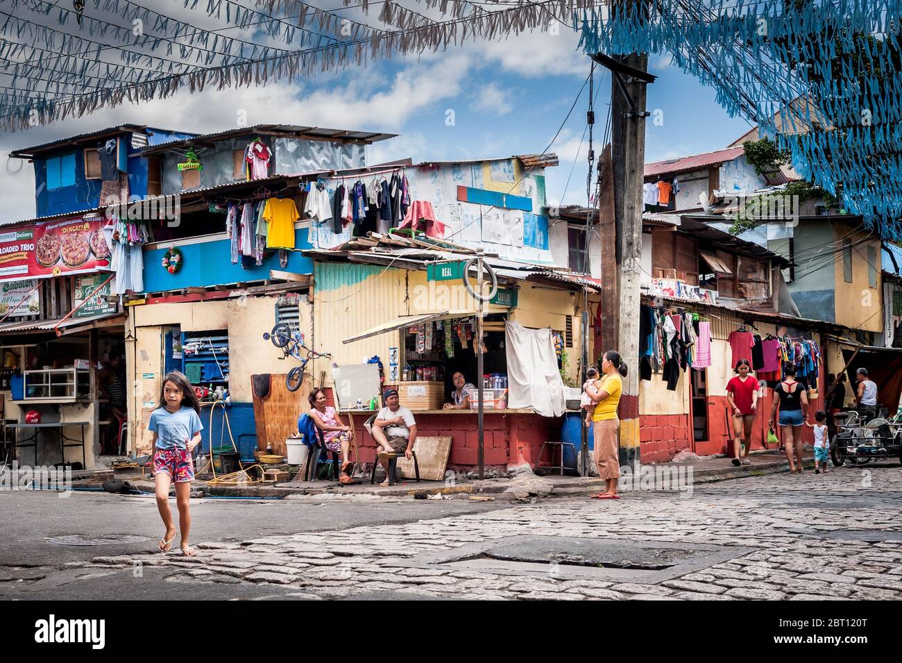 Shots of a colourful and busy road junction in the old walled city of ...