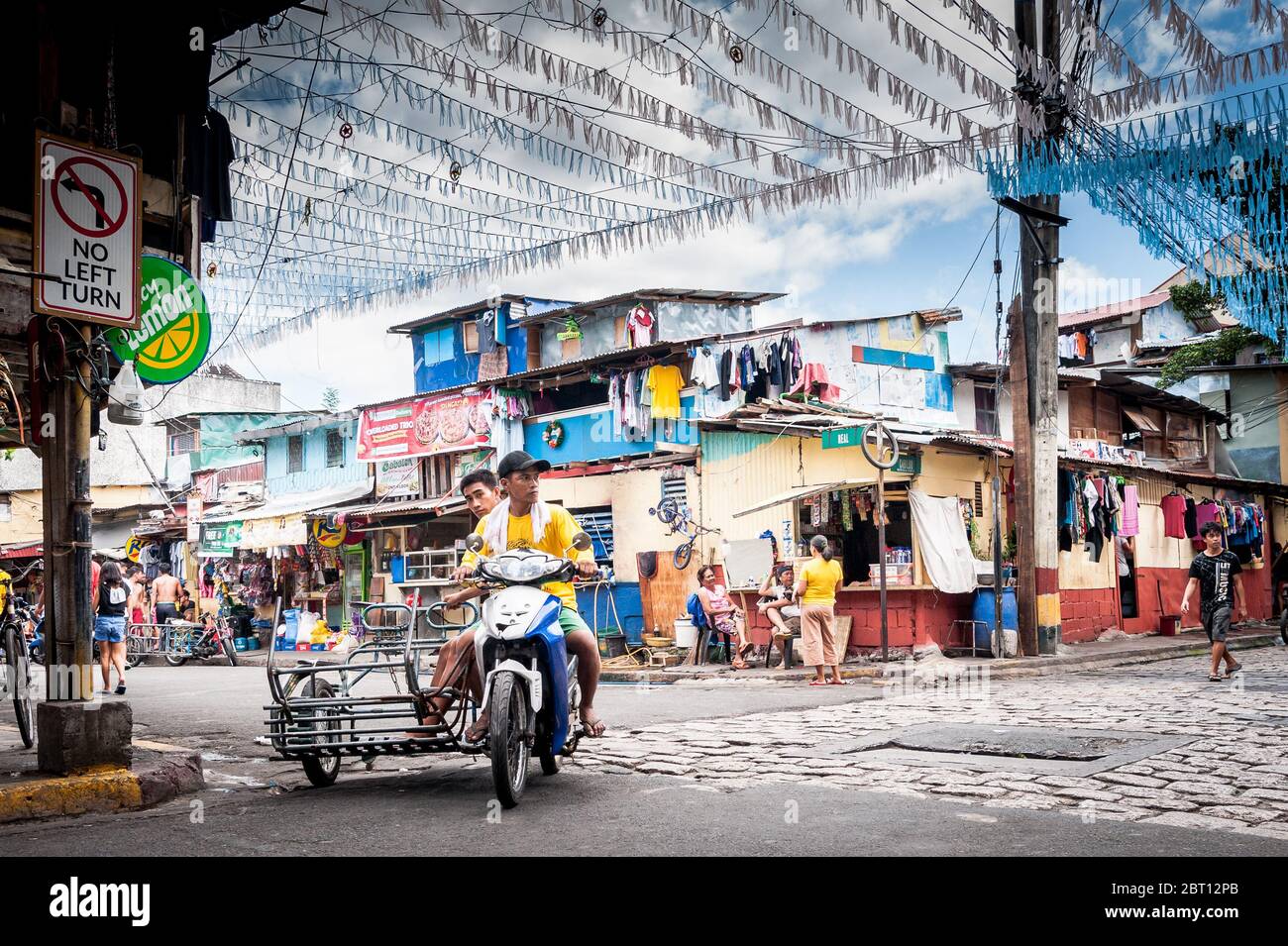 Shots of a colourful and busy road junction in the old walled city of ...