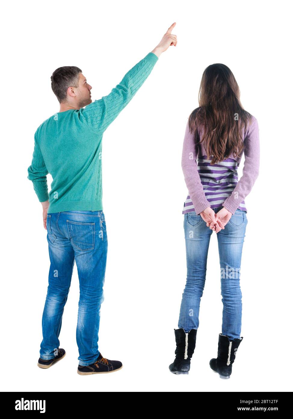 Back view of couple in sweater pointing. Rear view people collection ...