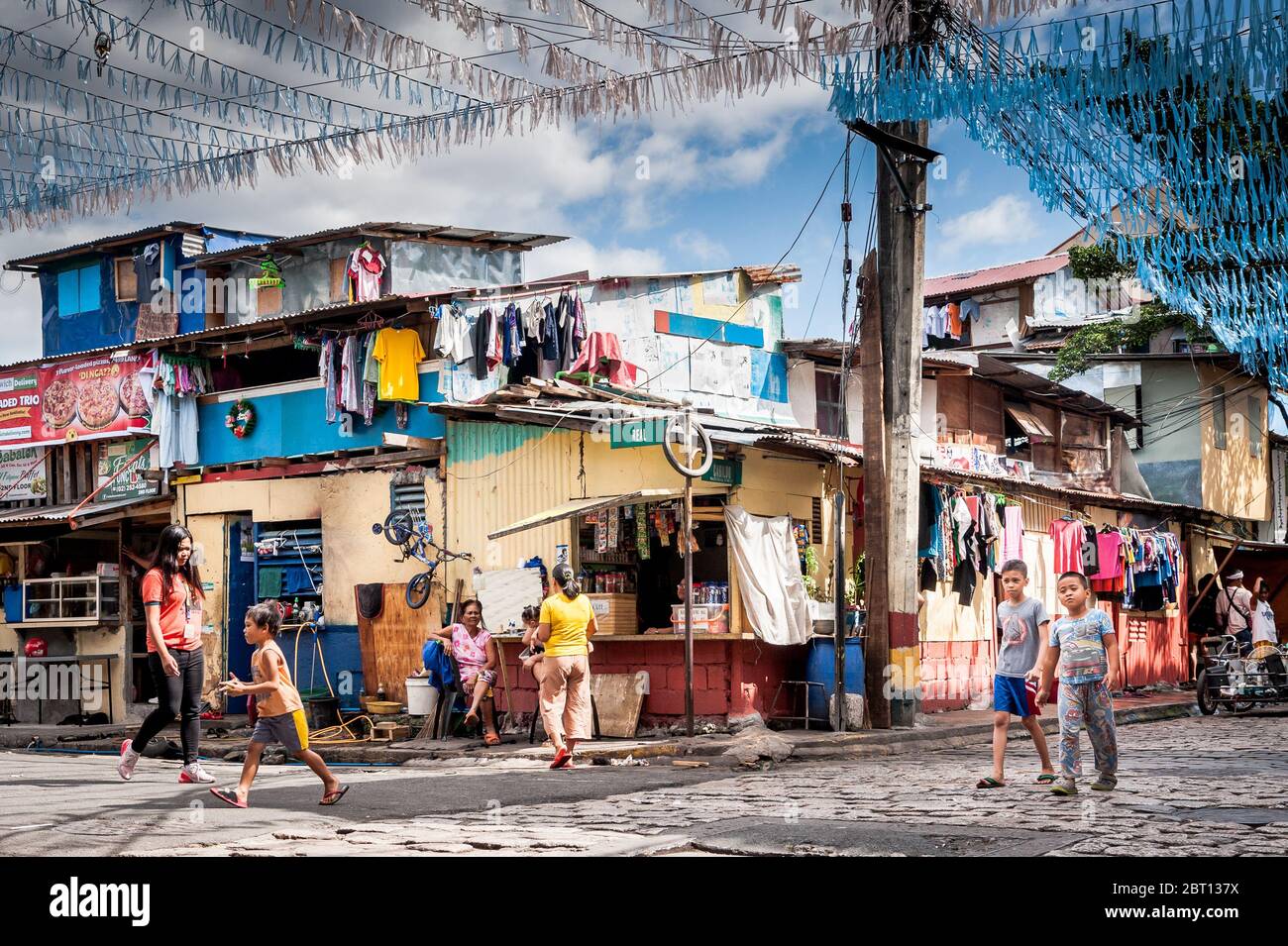 Shots of a colourful and busy road junction in the old walled city of ...