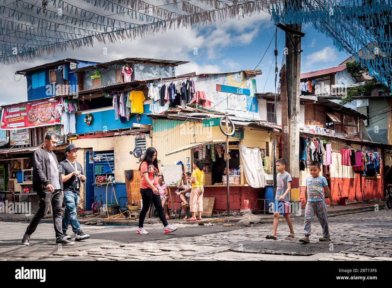 Shots of a colourful and busy road junction in the old walled city of ...