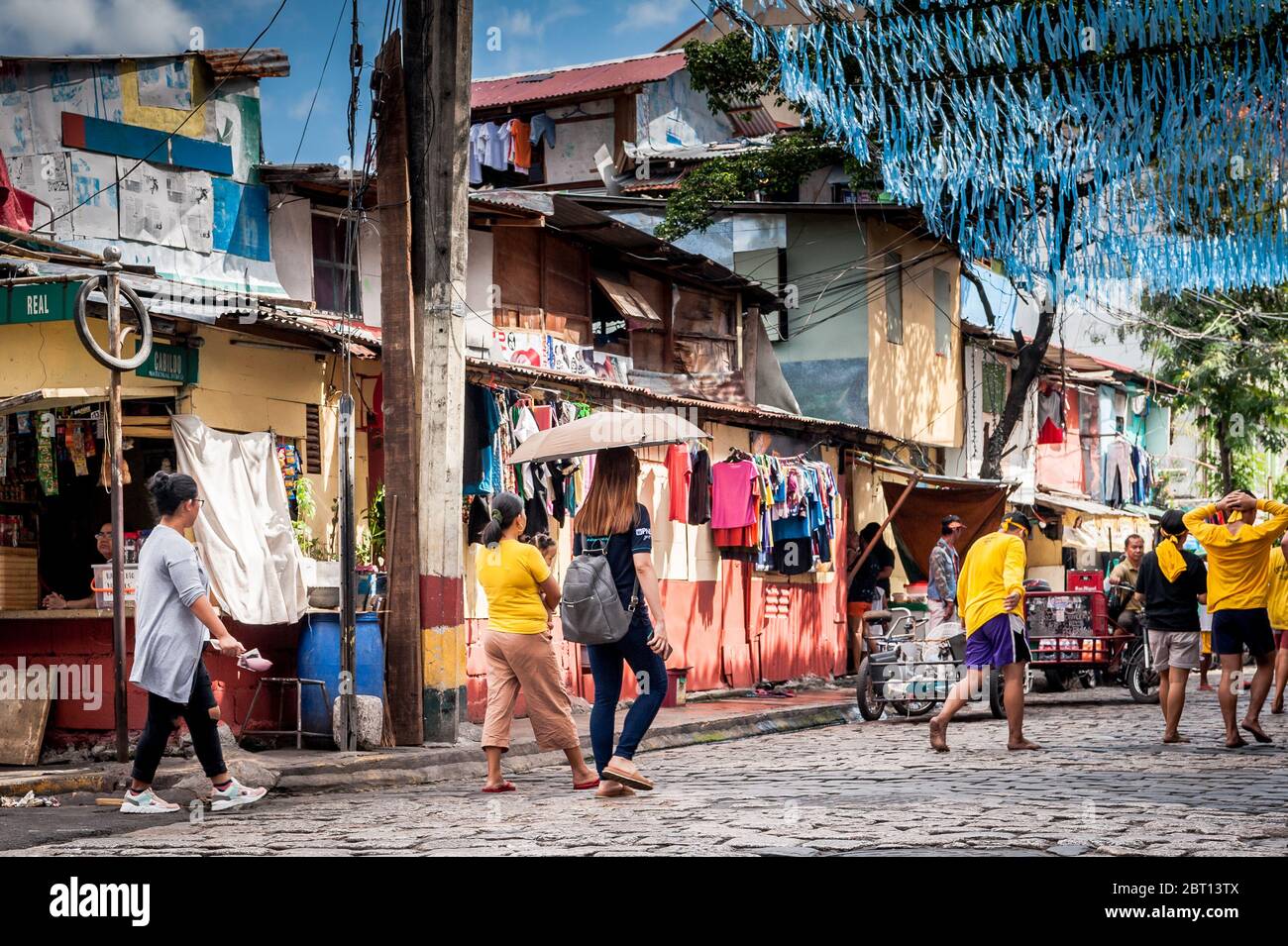 Shots of a colourful and busy road junction in the old walled city of ...