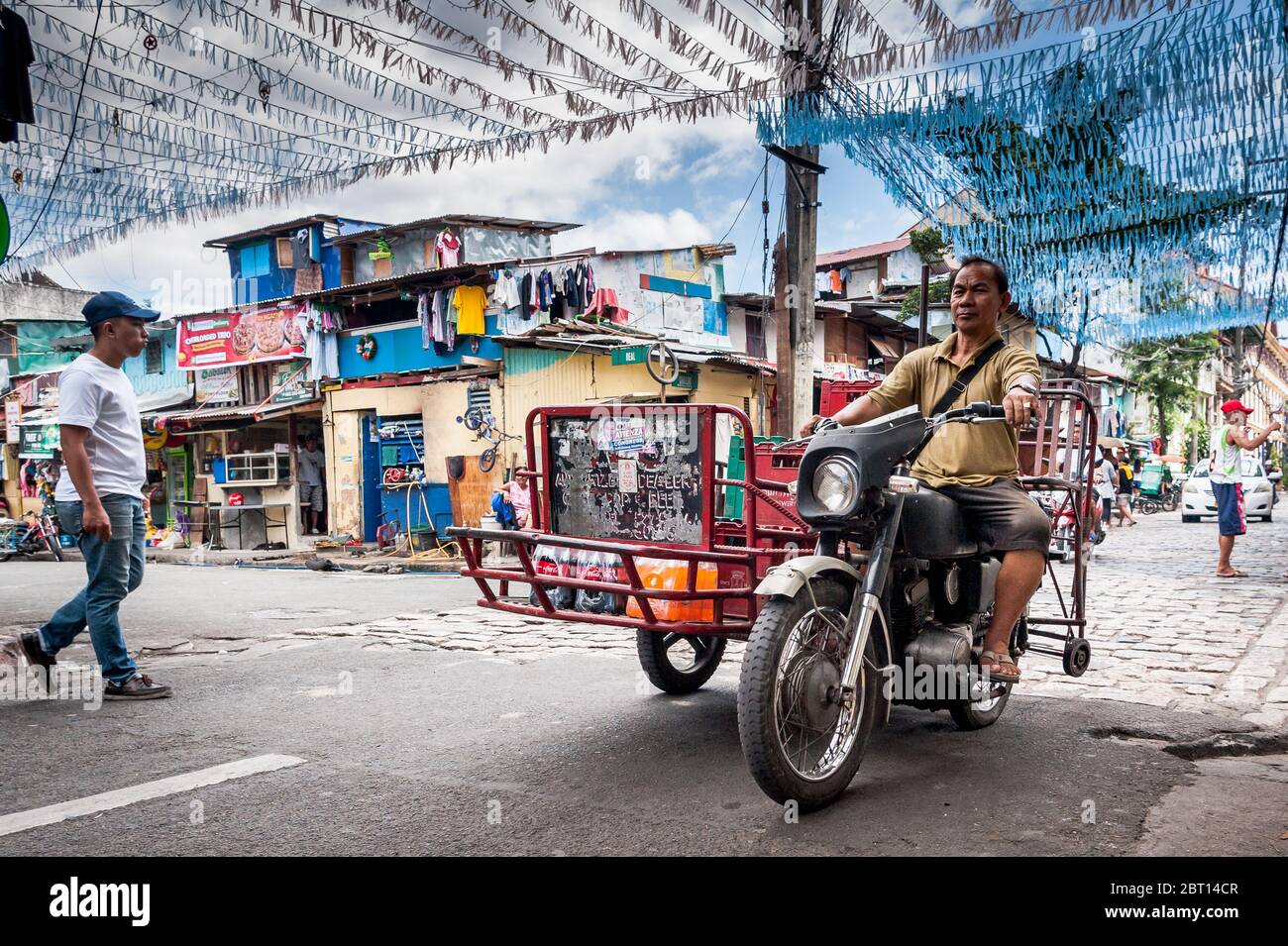 Shots of a colourful and busy road junction in the old walled city of ...