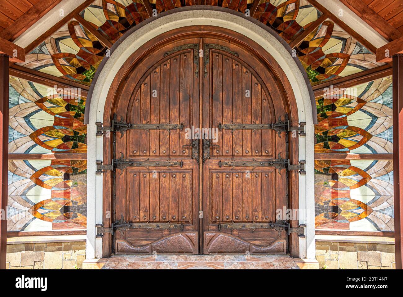 Ancient gates on the facade of the building Stock Photo - Alamy