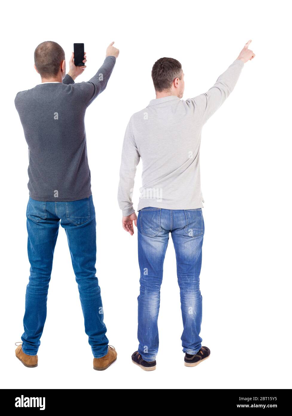 Back view of two man in sweater with mobile phone. Rear view people ...