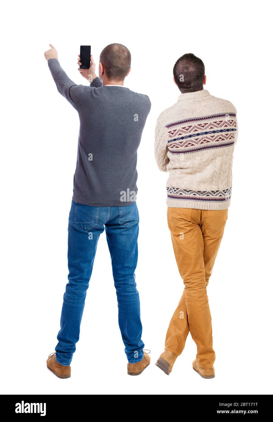 Back view of two man in sweater with mobile phone. Rear view people ...