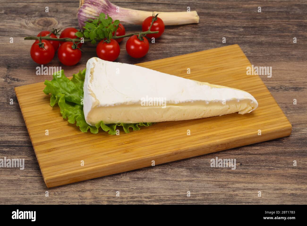 Brie cheese triangle served salad leaves Stock Photo - Alamy