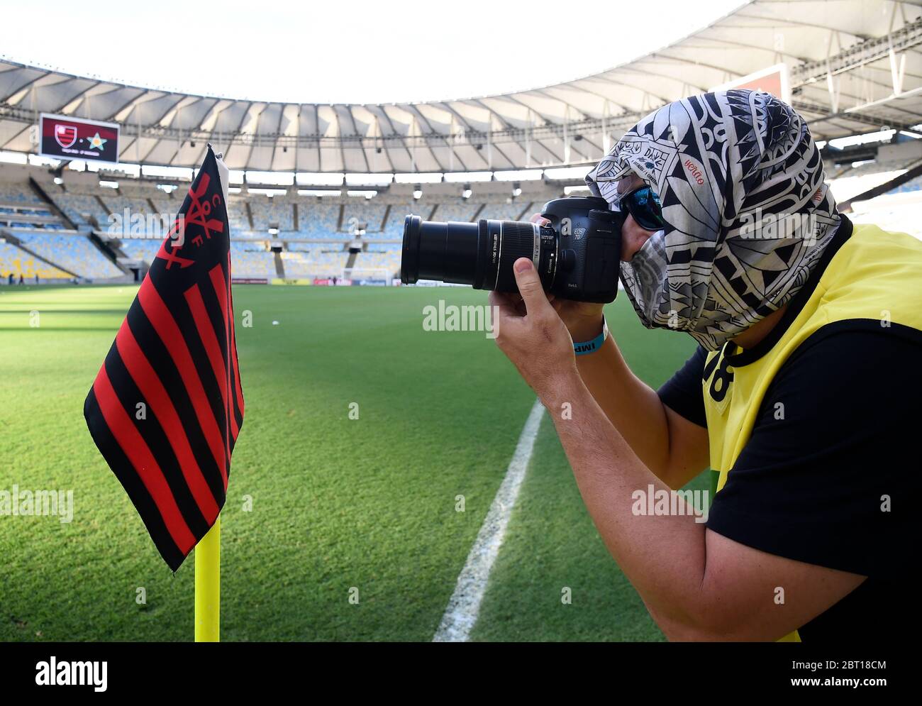 photographers wearing masks to work with security guards at football ...