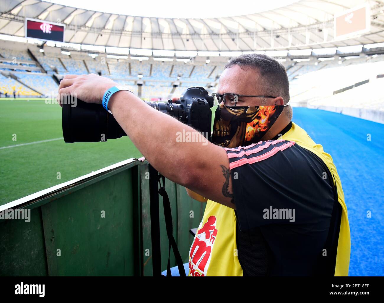 photographers wearing masks to work with security guards at football ...