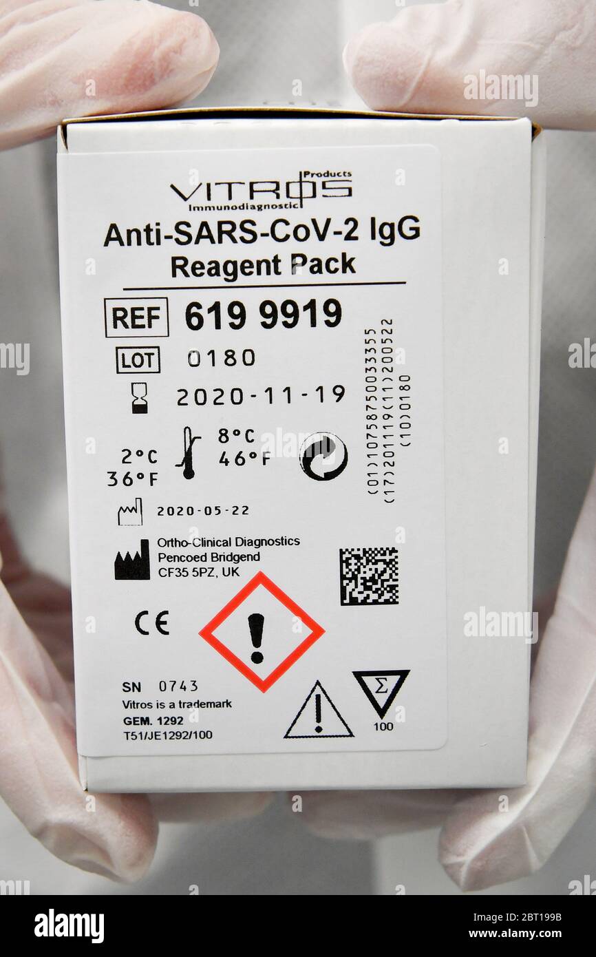 A boxed covid-19 antibody testing kit comes off the production line at ...