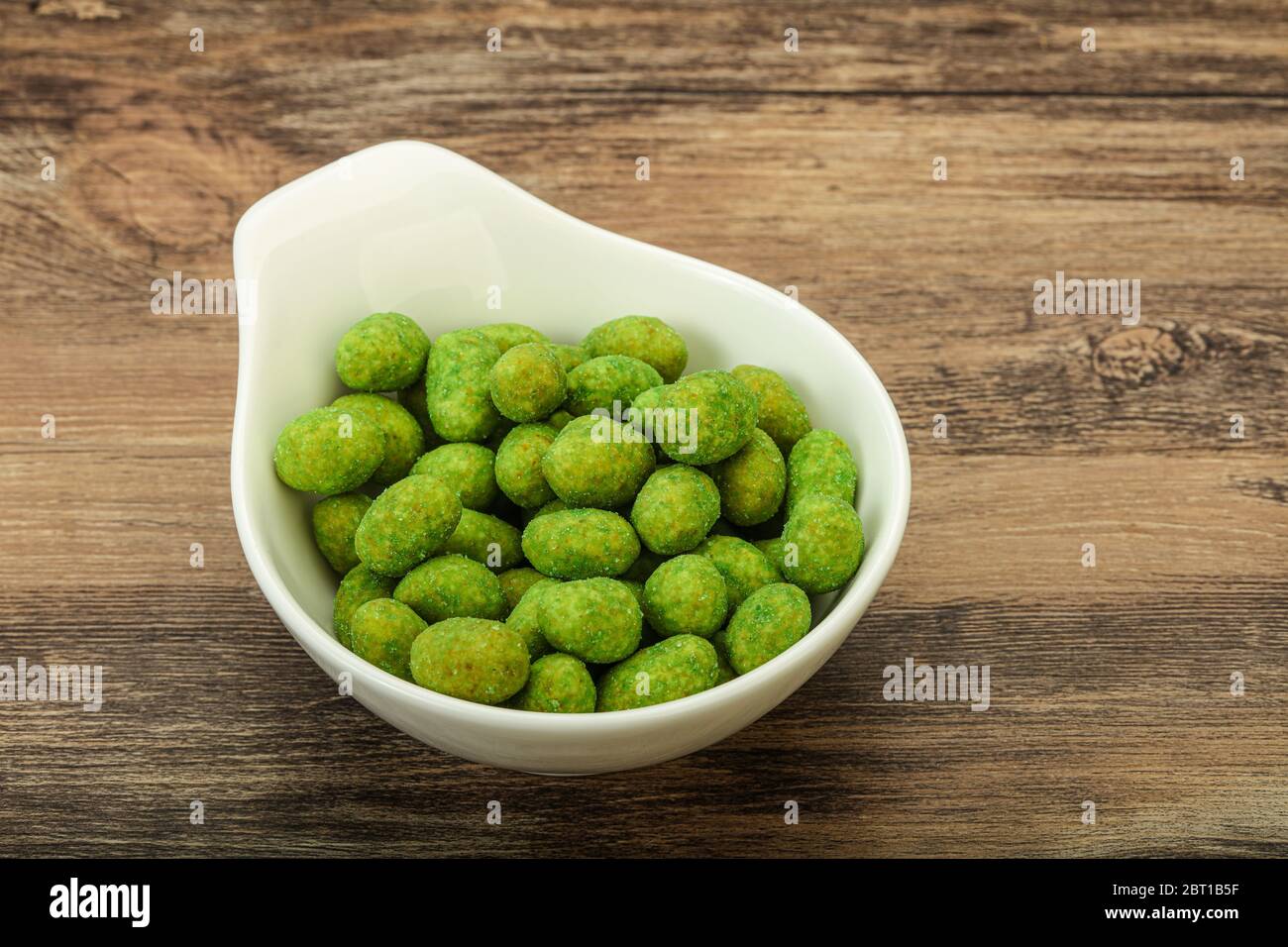Spicy wasabi peanuts snack in the bowl Stock Photo - Alamy