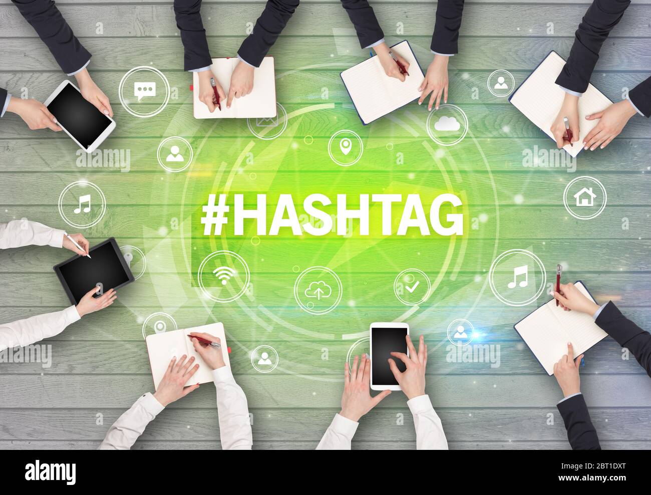 Group of people having a meeting with #HASHTAG insciption, social ...