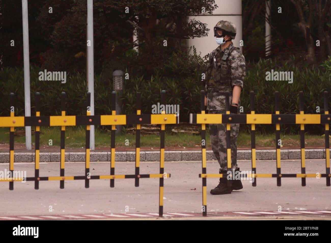 Hong Kong, CHINA. 22nd May, 2020. PLA Sentinel stand guard behind main ...