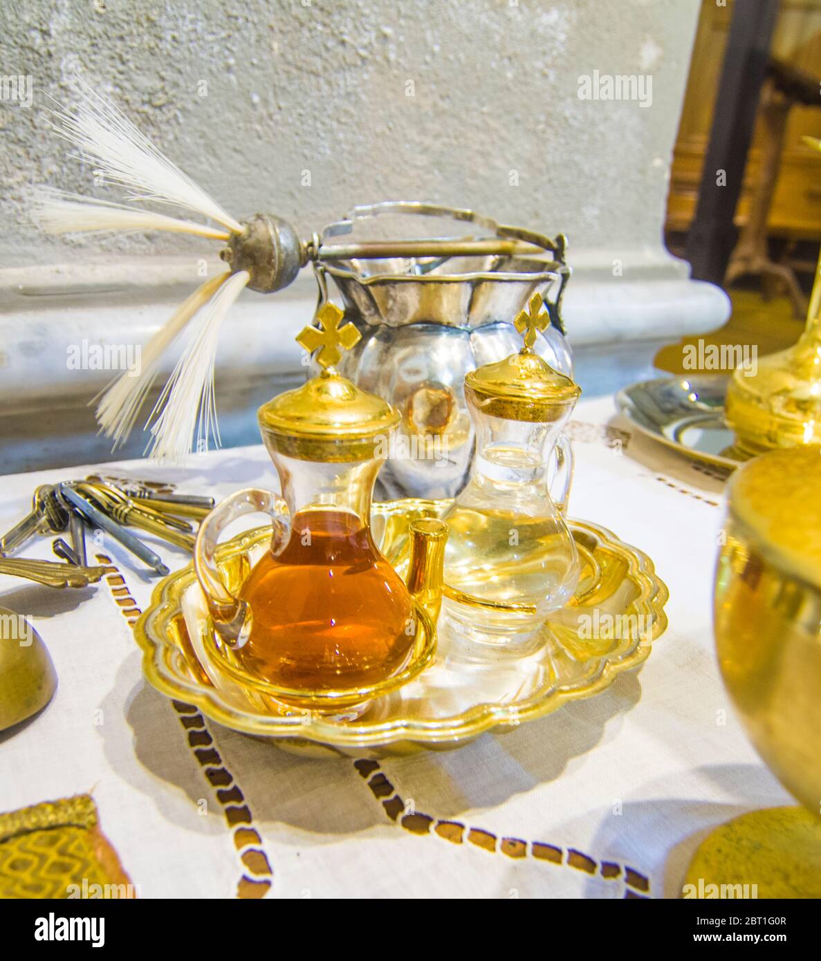 church altar with small wine vial ready to become the blood of jesus ...