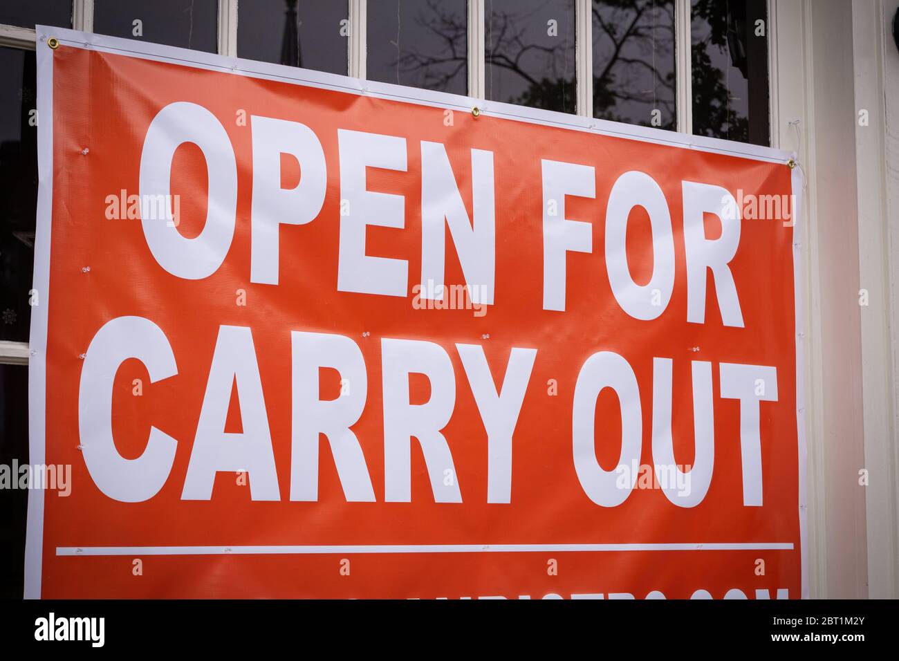 A "Open For Carry Out" sign outside of a restaurant during the Covid 19 ...