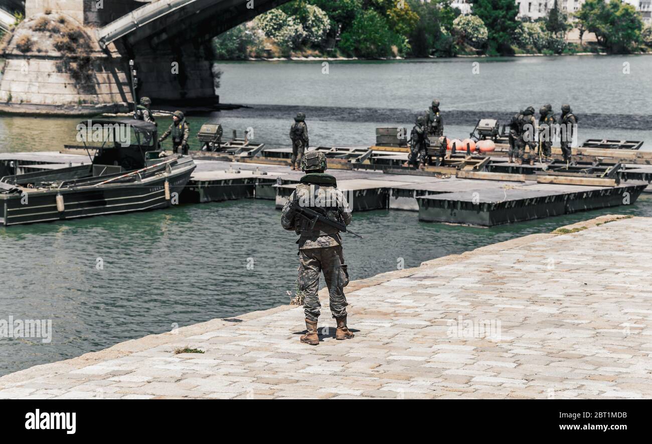 Army soldiers during military operation in the city. Selective focus ...