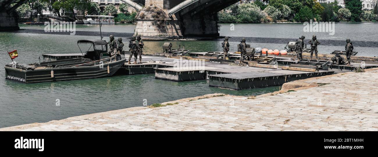 Panoramic scene of Army soldiers during military operation in the river ...