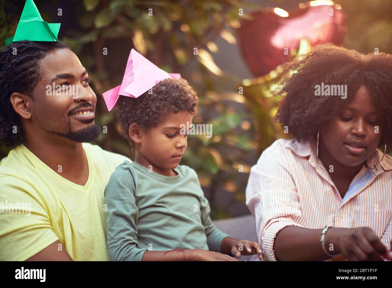 Afro-american family enjoying and having fun together at home with ...