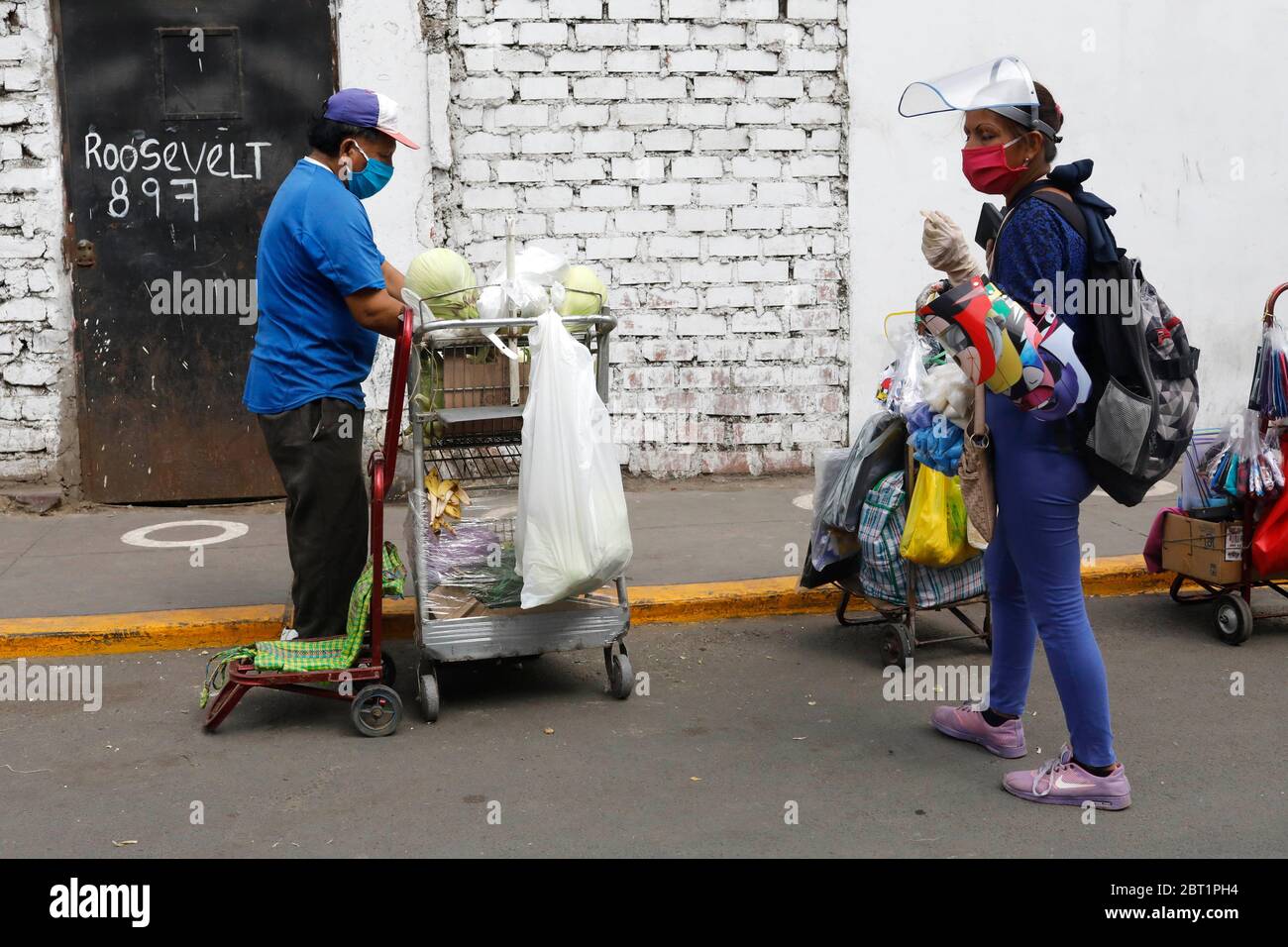 Lima, Peru. 21st May, 2020. Street vendors work at a street during the ...