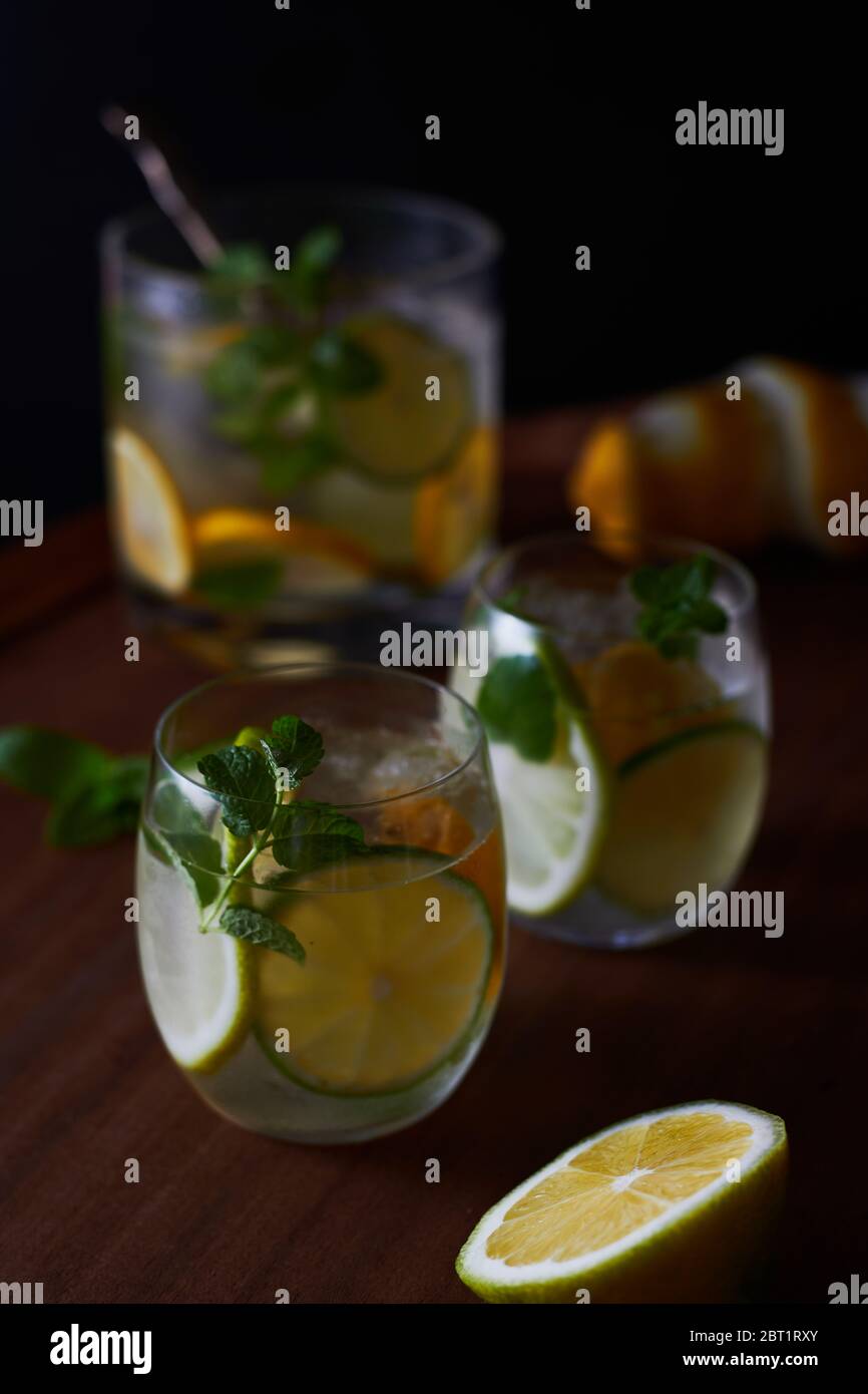Home made lemonade with slices of lime, lemon and peppermint served in ...