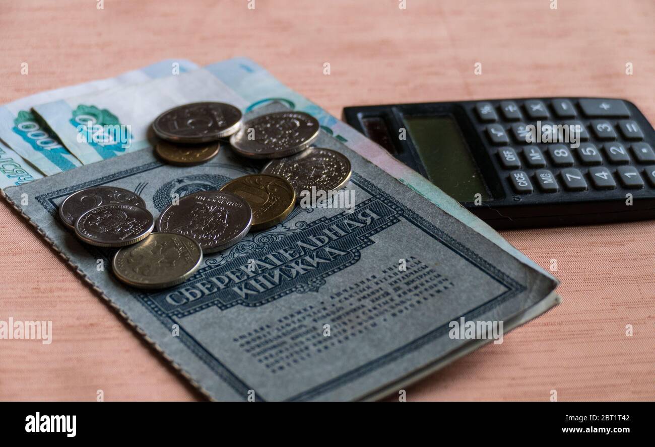 Saving book of Russia with coat of arms, calculator Stock Photo - Alamy