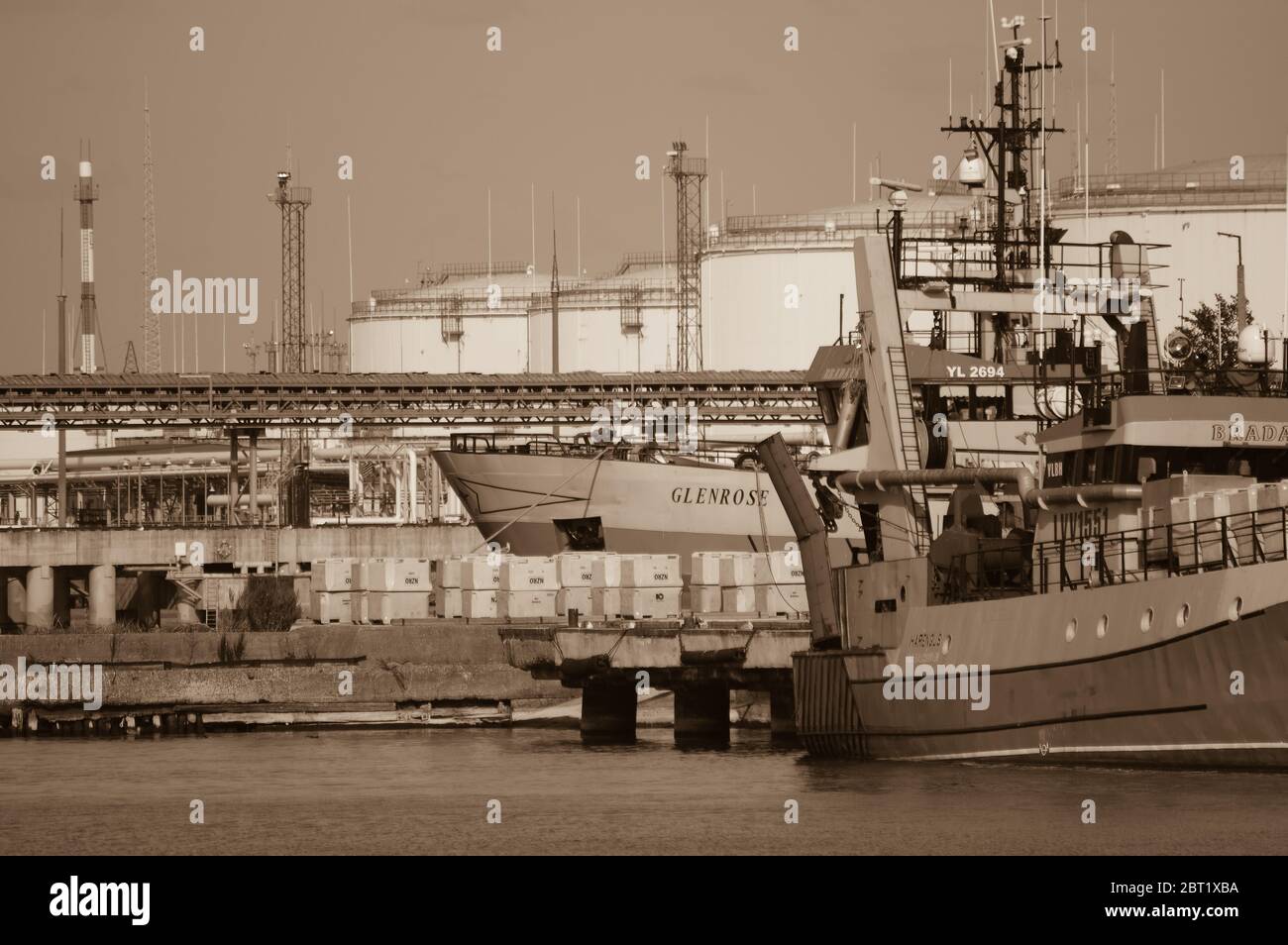 Modern steel fishing ships docked in port Stock Photo - Alamy
