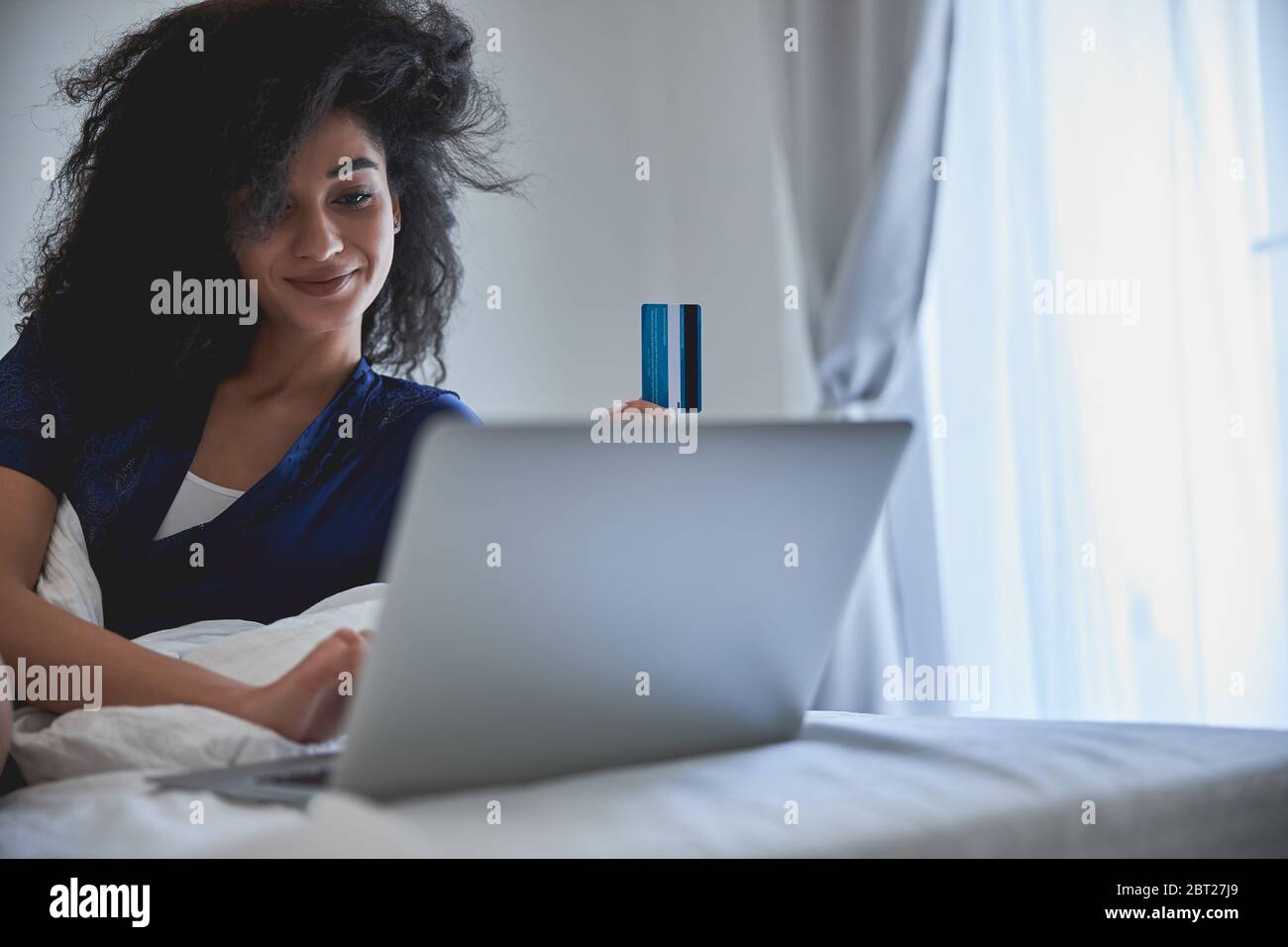 Attractive brunette female staring at screen of computer Stock Photo ...