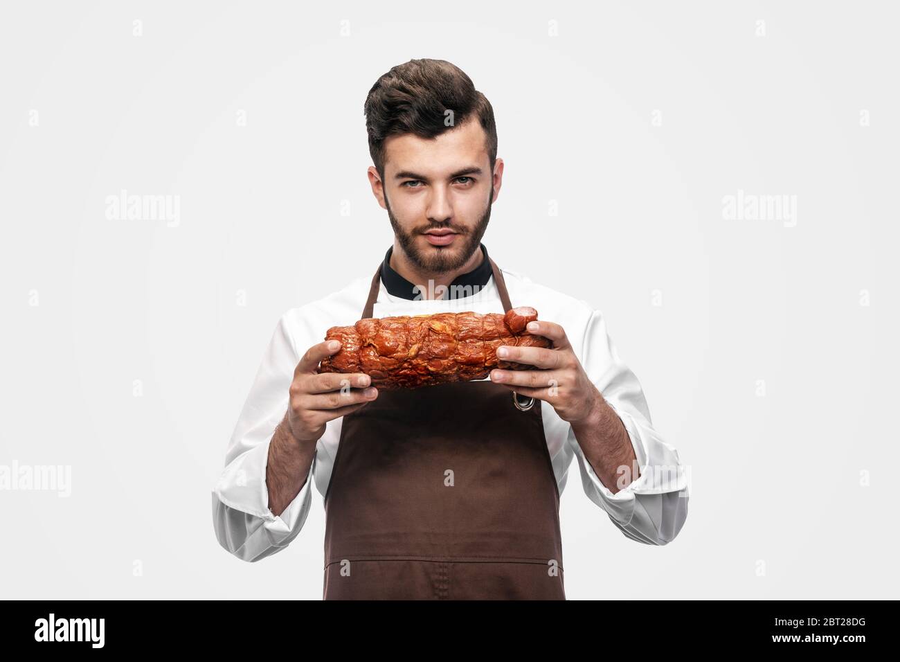 Man holding ham delicatessen hi-res stock photography and images - Alamy