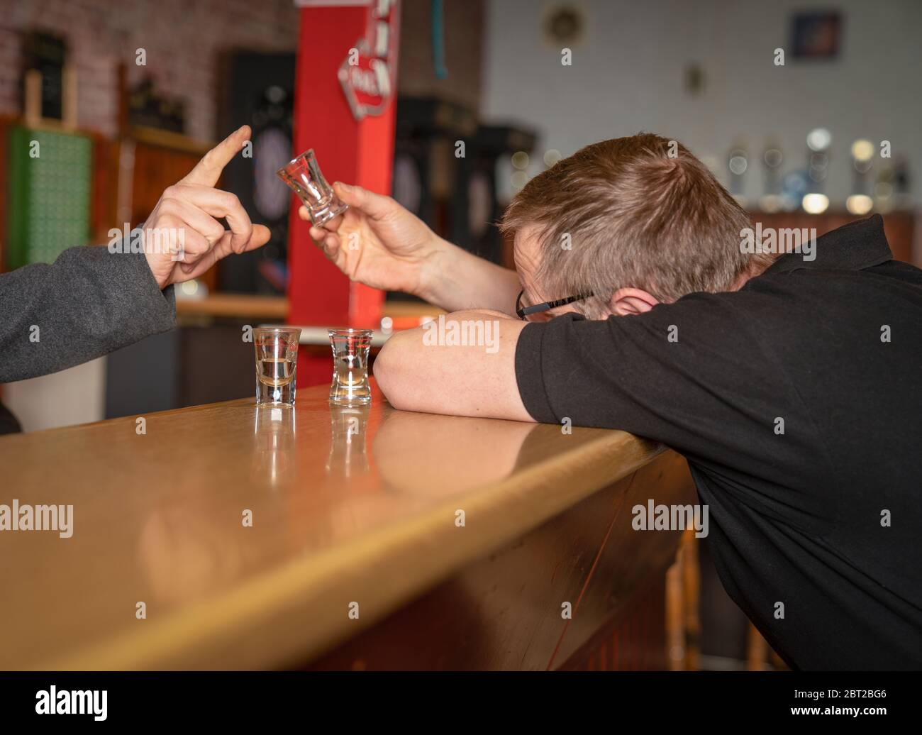 a drunk man no longer gets alcohol in the pub Stock Photo - Alamy