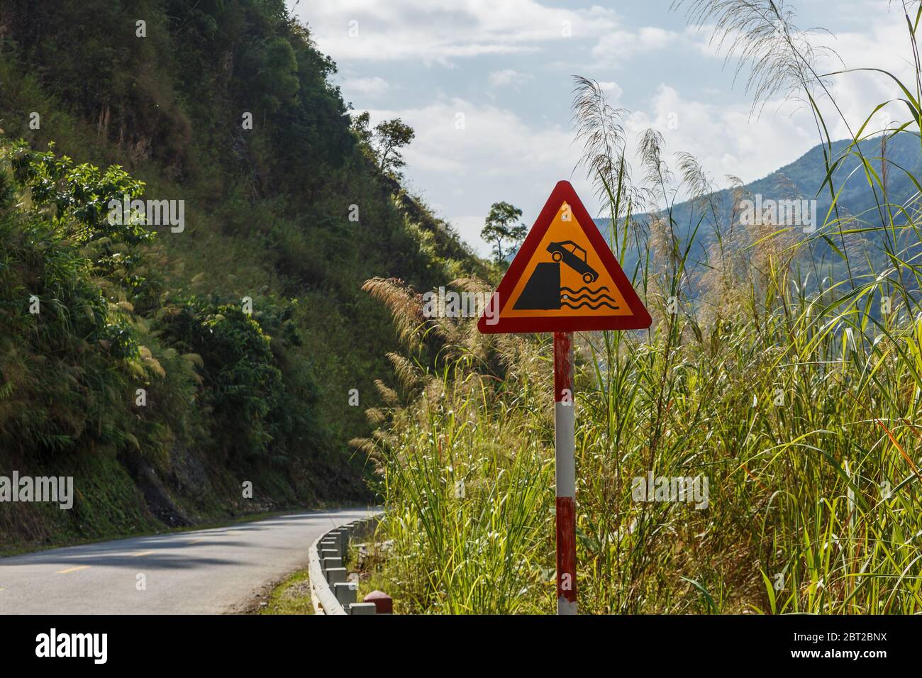 Quayside or river bank. road sign on the mountain road, Vietnam Stock ...