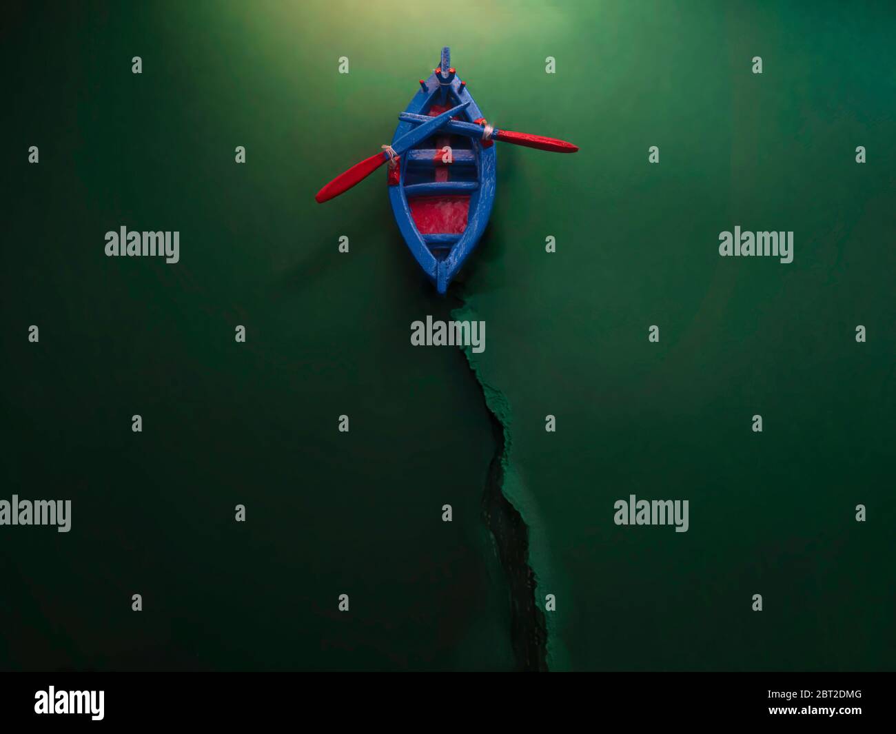 Conceptual rowing boat at sea Stock Photo - Alamy