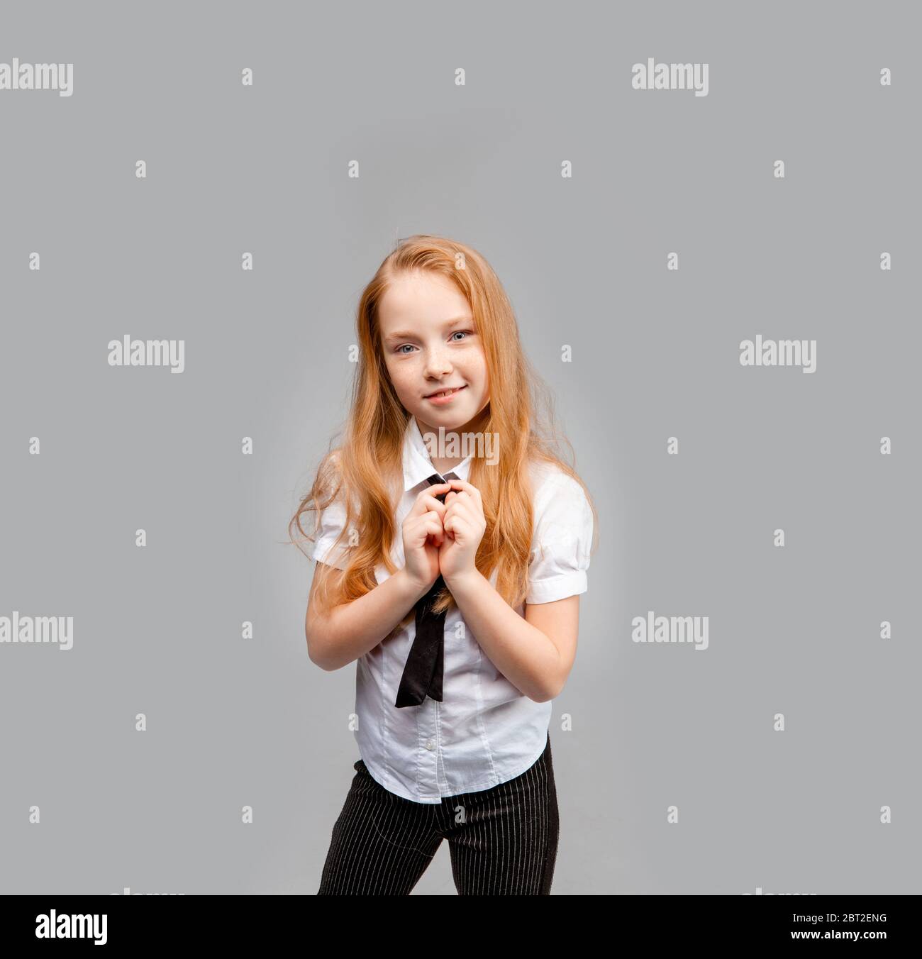 cute girl in office clothes smiling Stock Photo - Alamy