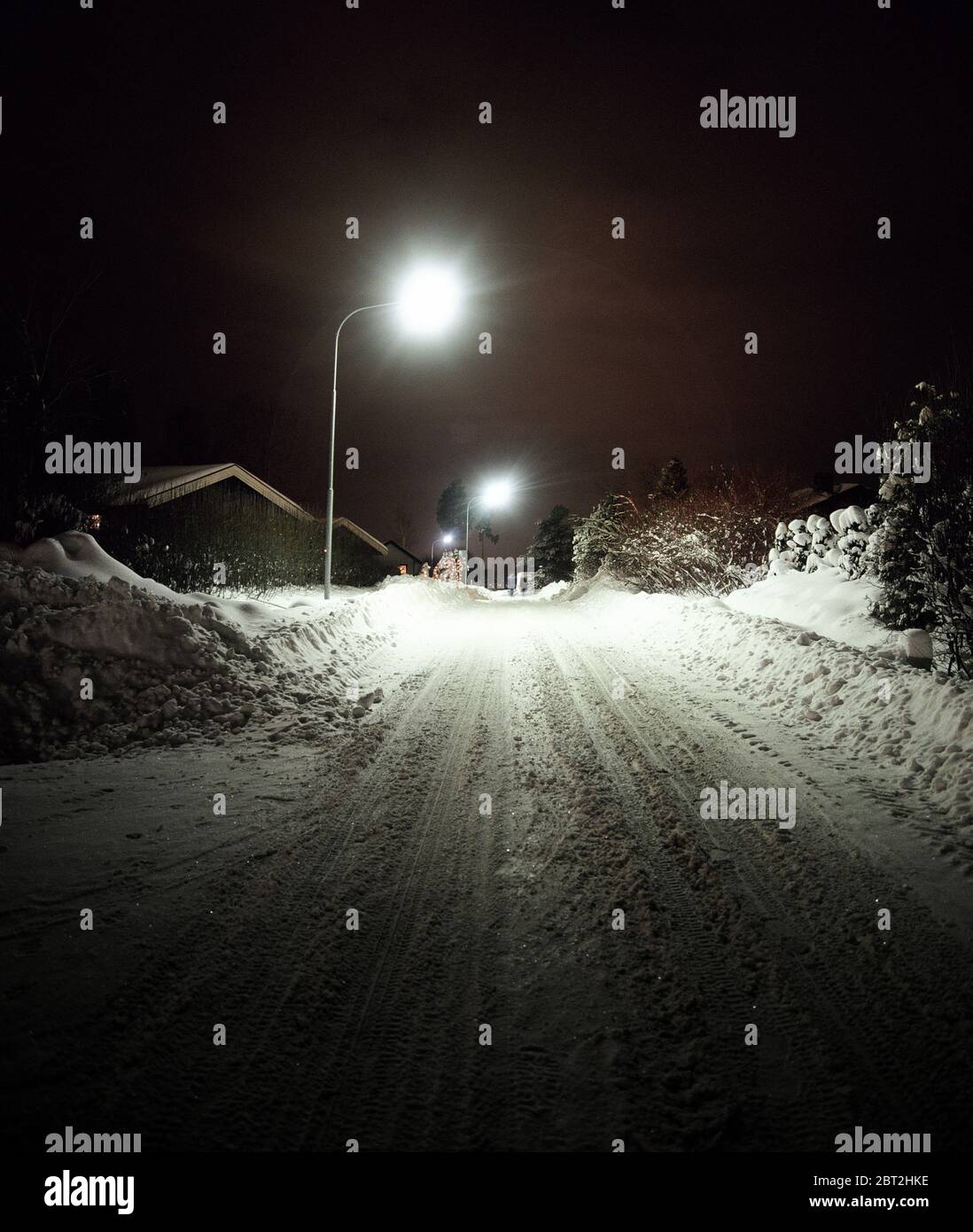 Snow-covered Street at Night Stock Photo - Alamy