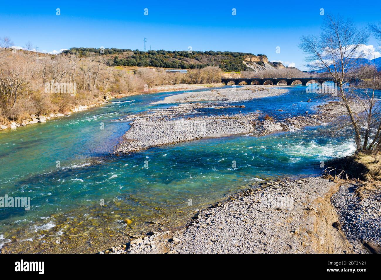 Riverbed and bridge in a natural landscape Stock Photo - Alamy