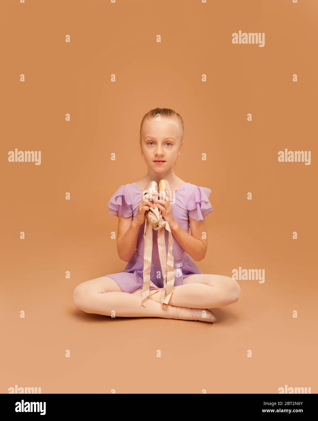 girl in clothes for ballroom dancing shows movements from the dance ...