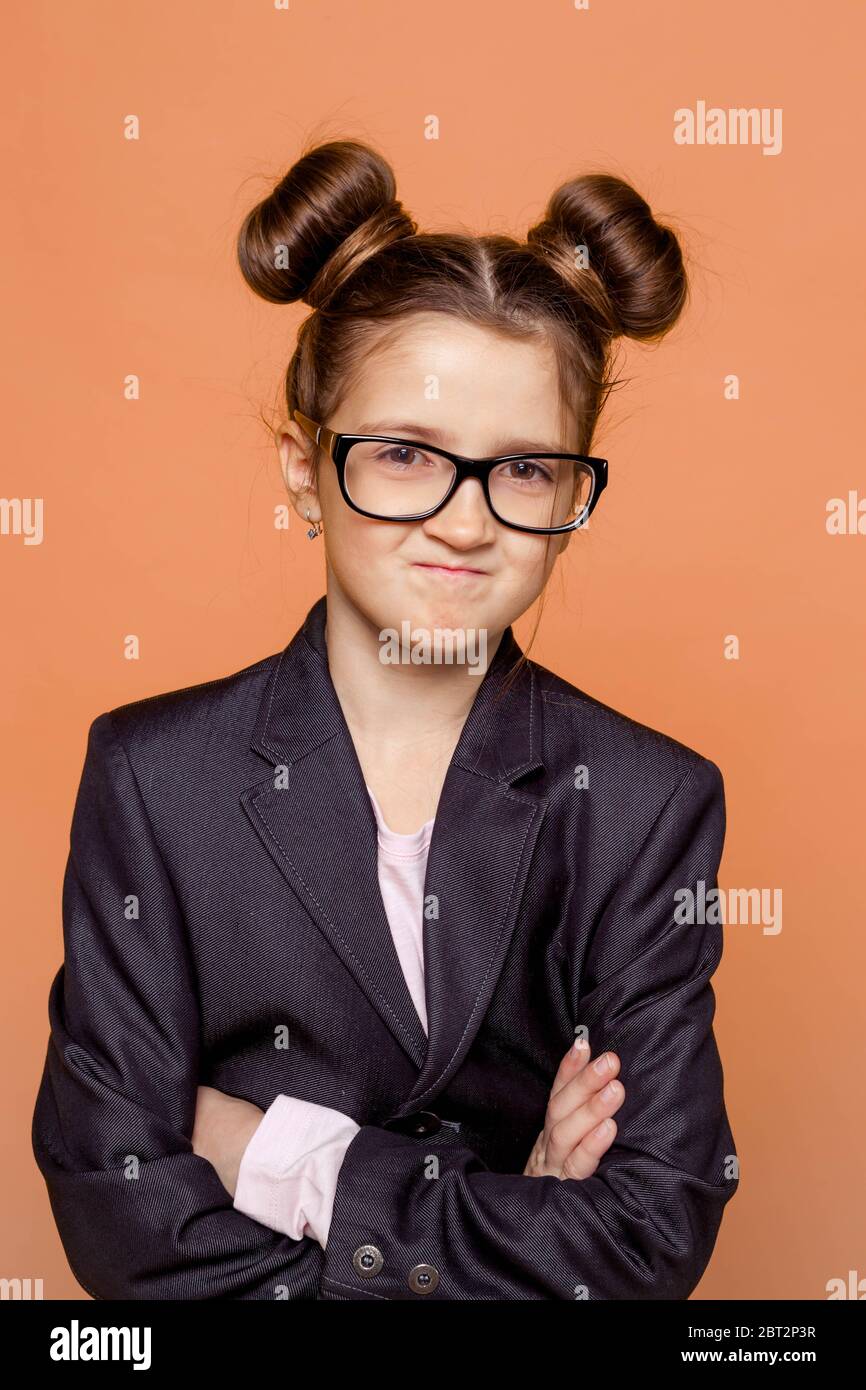 girl dressed in a jacket crossed her arms over her chest Stock Photo ...
