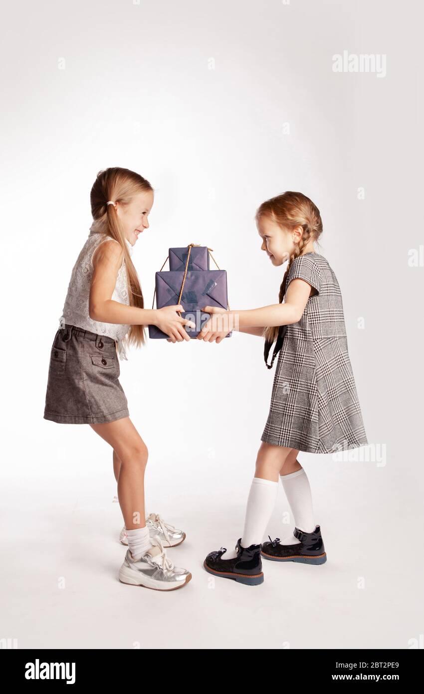 Two girls with gift boxes hi-res stock photography and images - Alamy